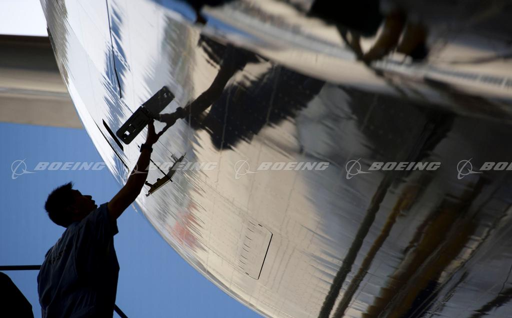 Boeing Images - Mechanic Inspecting Boeing 777
