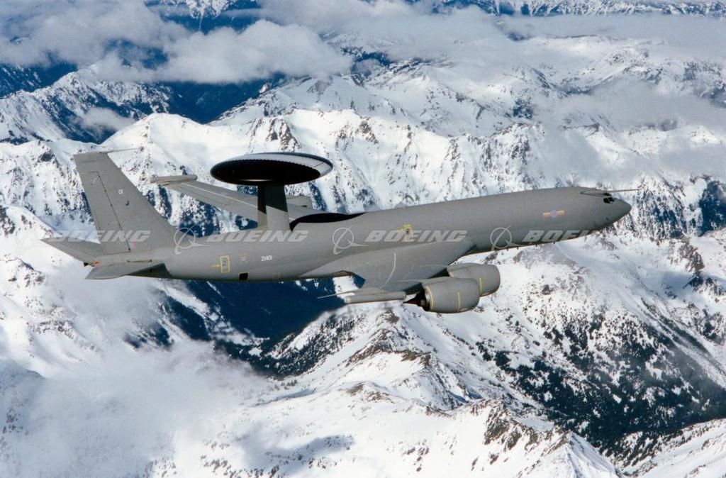Boeing Images - E-3 AWACS in Flight over Snowy Mountains