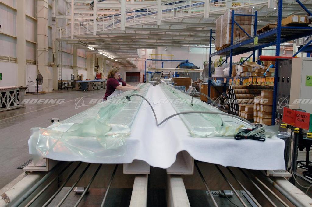 Boeing Images - Carbon Fiber Composite Beams are Prepared for Curing