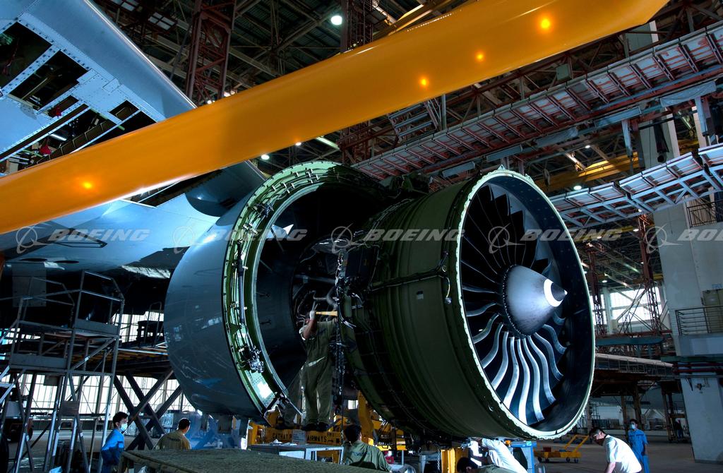 Boeing Images - Mechanic Inspecting Boeing 777 Engine