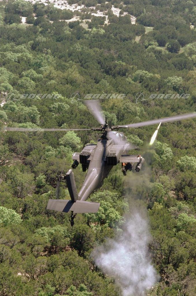 Boeing Images - AH-64A Apache Firing a 70mm Rocket in Flight