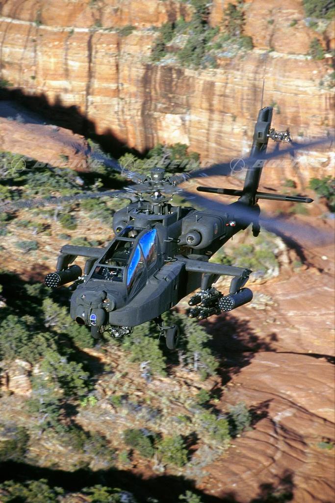 Boeing Images - AH-64D Apache in Flight over Desert Canyon