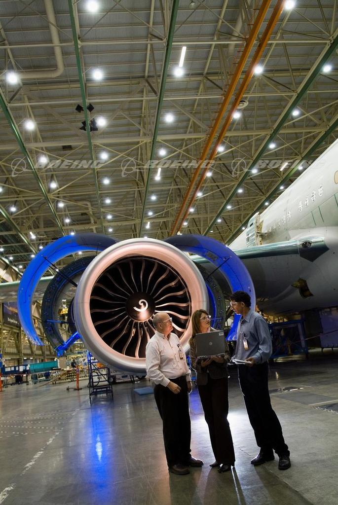 Boeing Images - Boeing Engineers with 777 Engine in Factory
