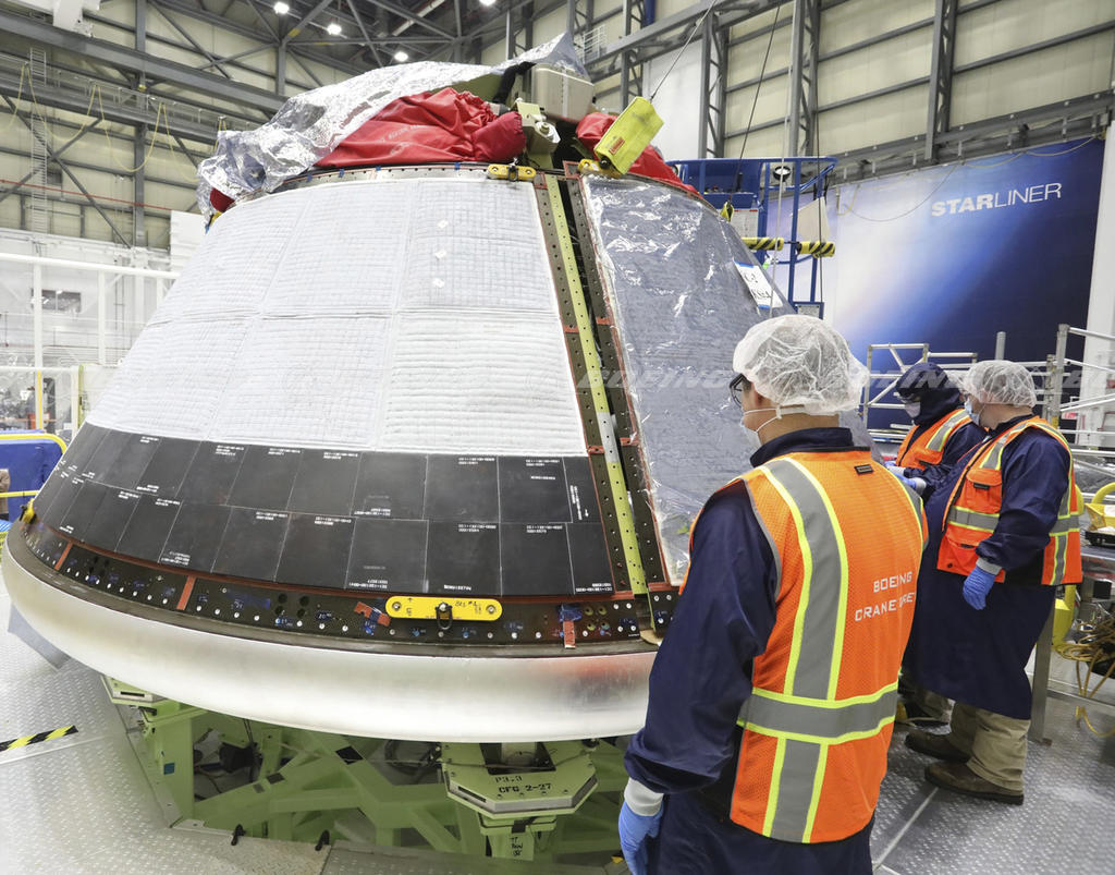 Boeing Images - Starliner technicians finish installing back shells on ...