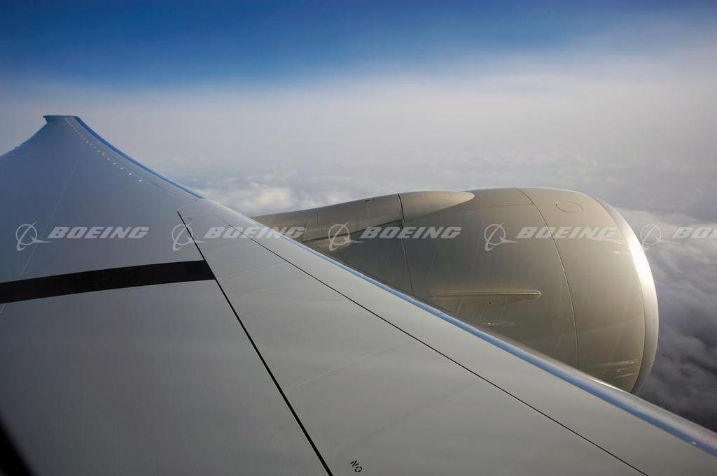 Boeing Images - 777-300ER Wing and Nacelle Extend Out Over Clouds