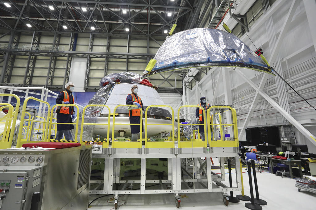 Boeing Images - Installation of back shells on the Orbital Flight Test ...