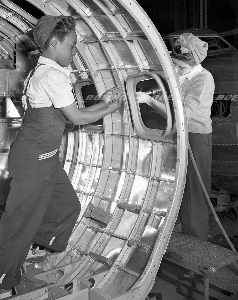 Boeing Images - Boeing Employees Bucks Rivets on a B-17 Flying Fortress