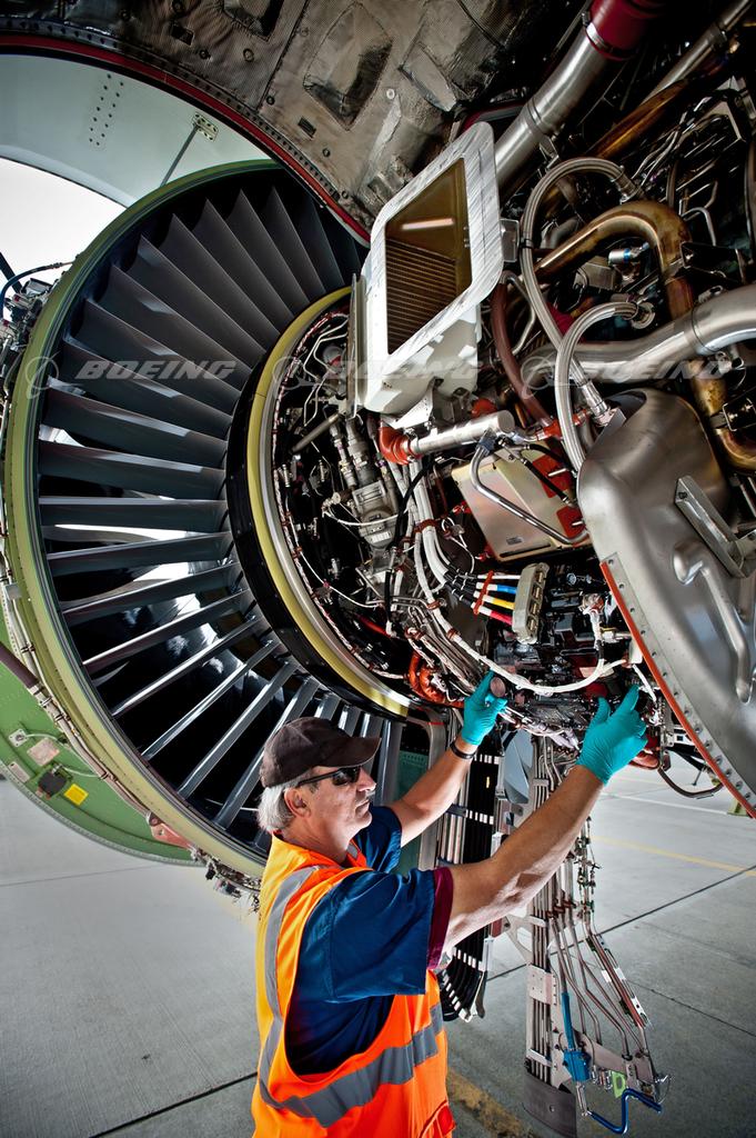 Boeing Images - Boeing Mechanic Inspects 777 Engine