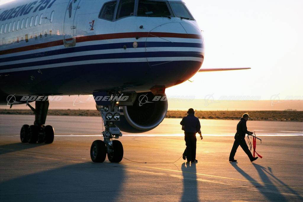 Boeing Images - Ground Crew with the First 757-200 at Sunset