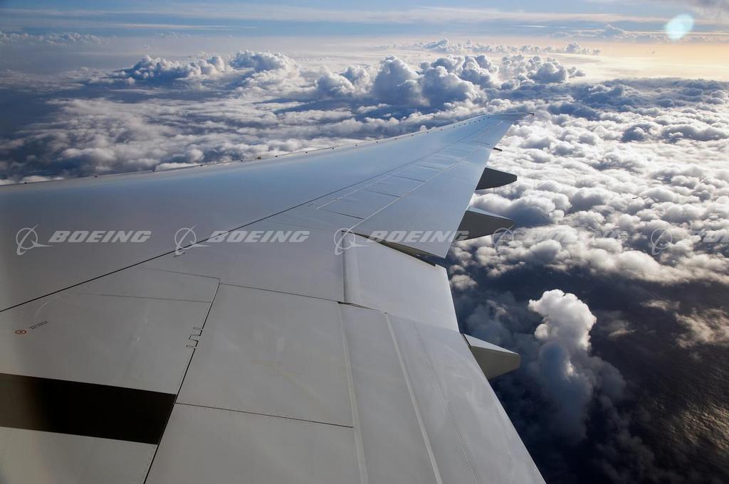 Boeing Images - Boeing 777-300ER Wing Above Clouds