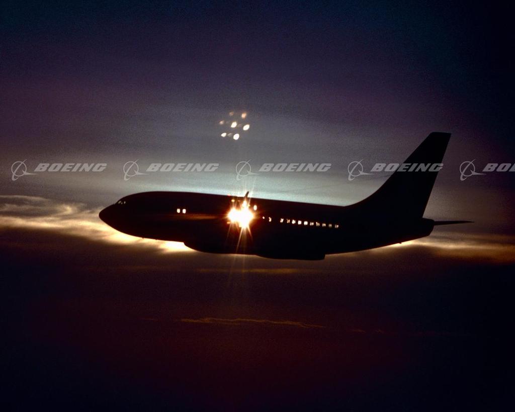 Boeing Images - 737-200 in Flight, with Setting Sun Visible Through Windows