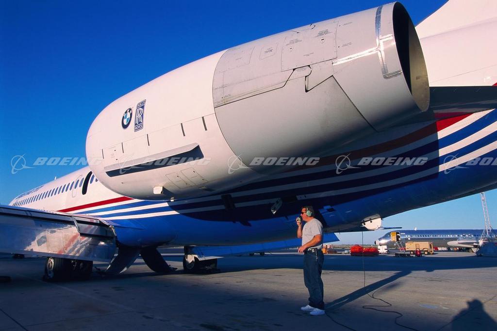 Boeing Images - Aircraft Service Worker Under the Left Engine Pod of a ...
