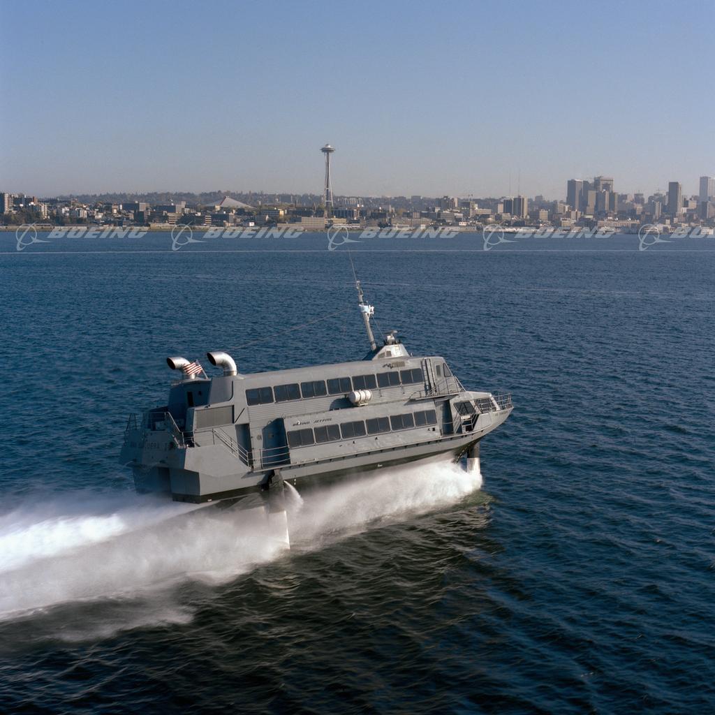 Boeing Images - Hydrofoil Cruises past Seattle Cityscape