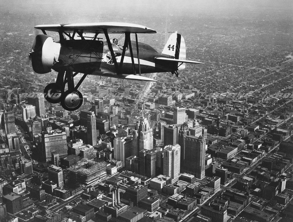 Boeing Images - P-12E Army Biplane Fighter Flying over Detroit